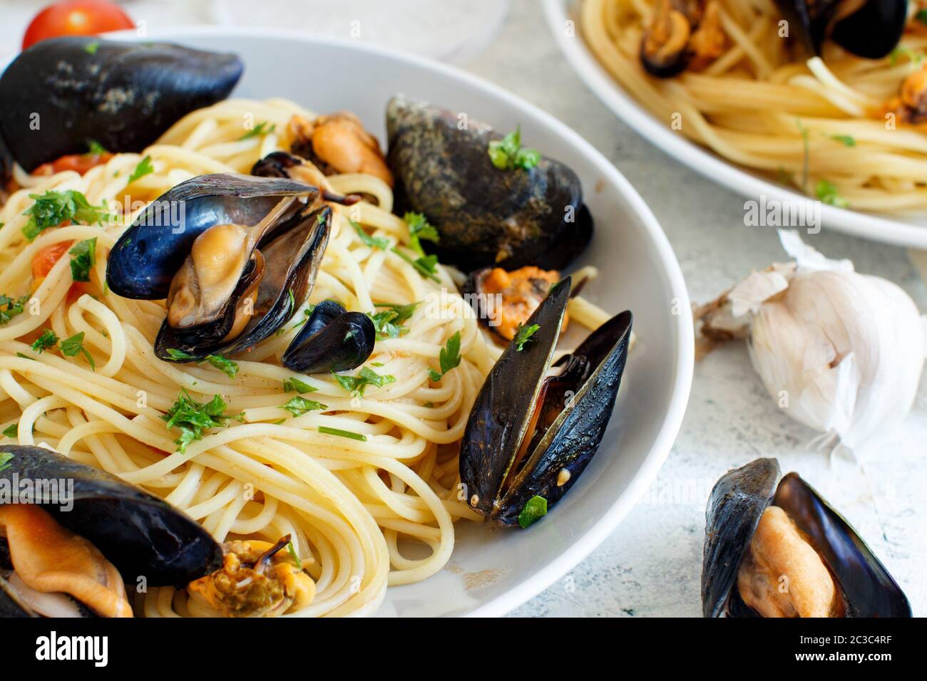 Spaghetti with mussels and tomatoes italian seafood pasta close up ...