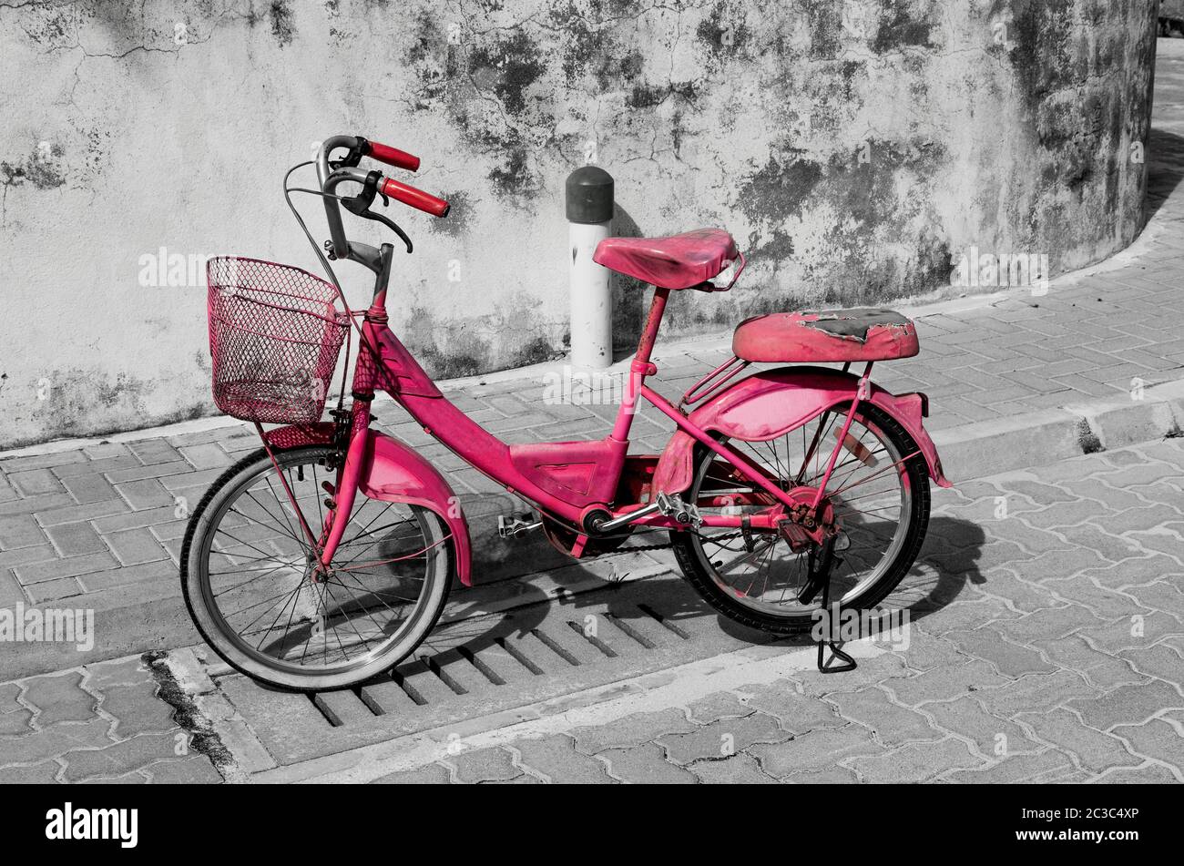 Pink bicycle Meedhoo Raa Atoll Island Maldives Stock Photo - Alamy