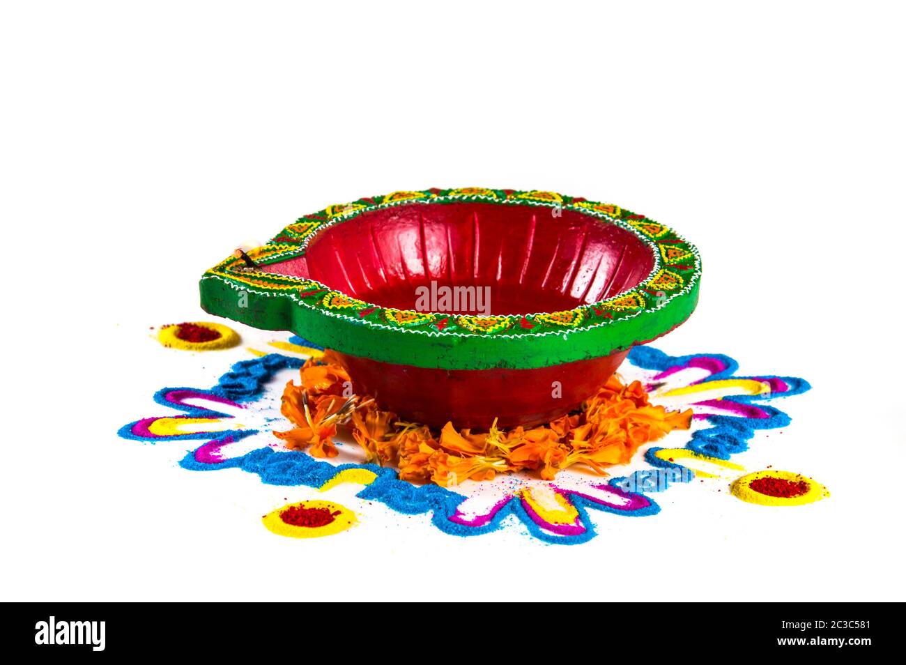 Clay diya lamp lit during diwali festival. Clay Diya on Rangoli. Happy ...