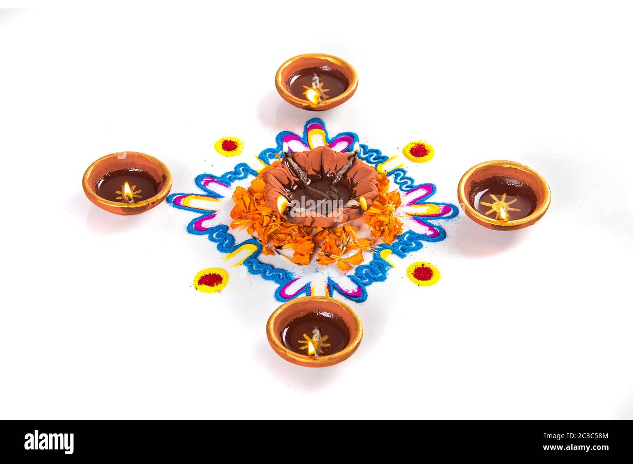 Clay diya lamp lit during diwali festival. Clay Diya on Rangoli. Happy ...