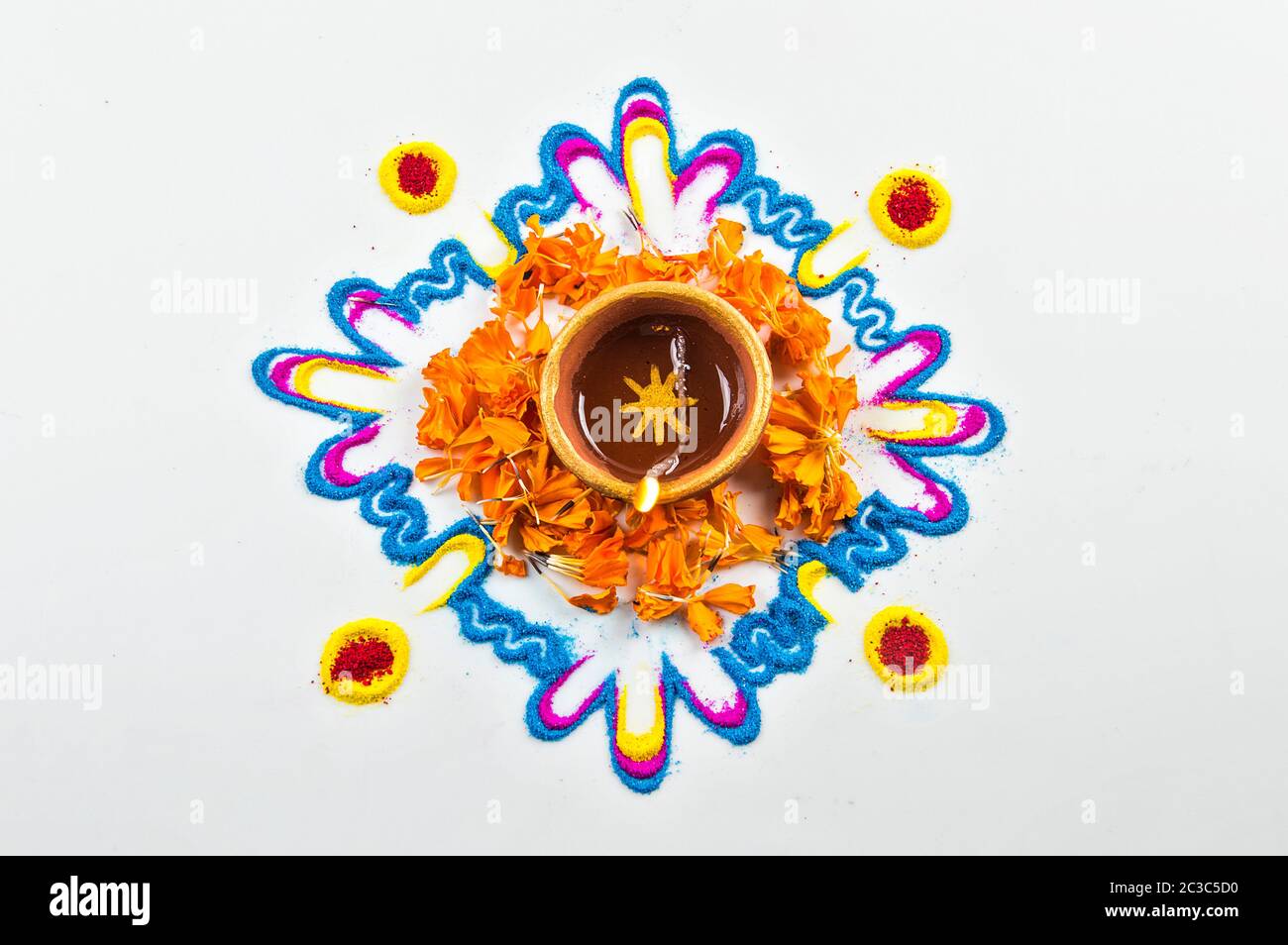 Clay diya lamp lit during diwali festival. Clay Diya on Rangoli. Happy ...
