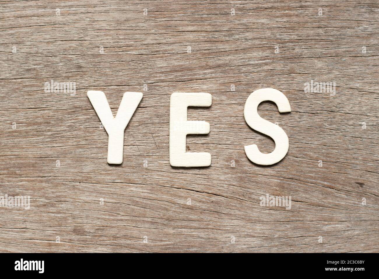 Alphabet letter in word yes on wood background Stock Photo - Alamy