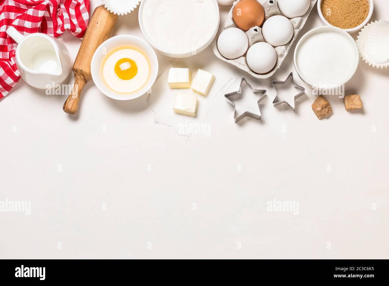 Baking ingredients at blue table top view Stock Photo - Alamy
