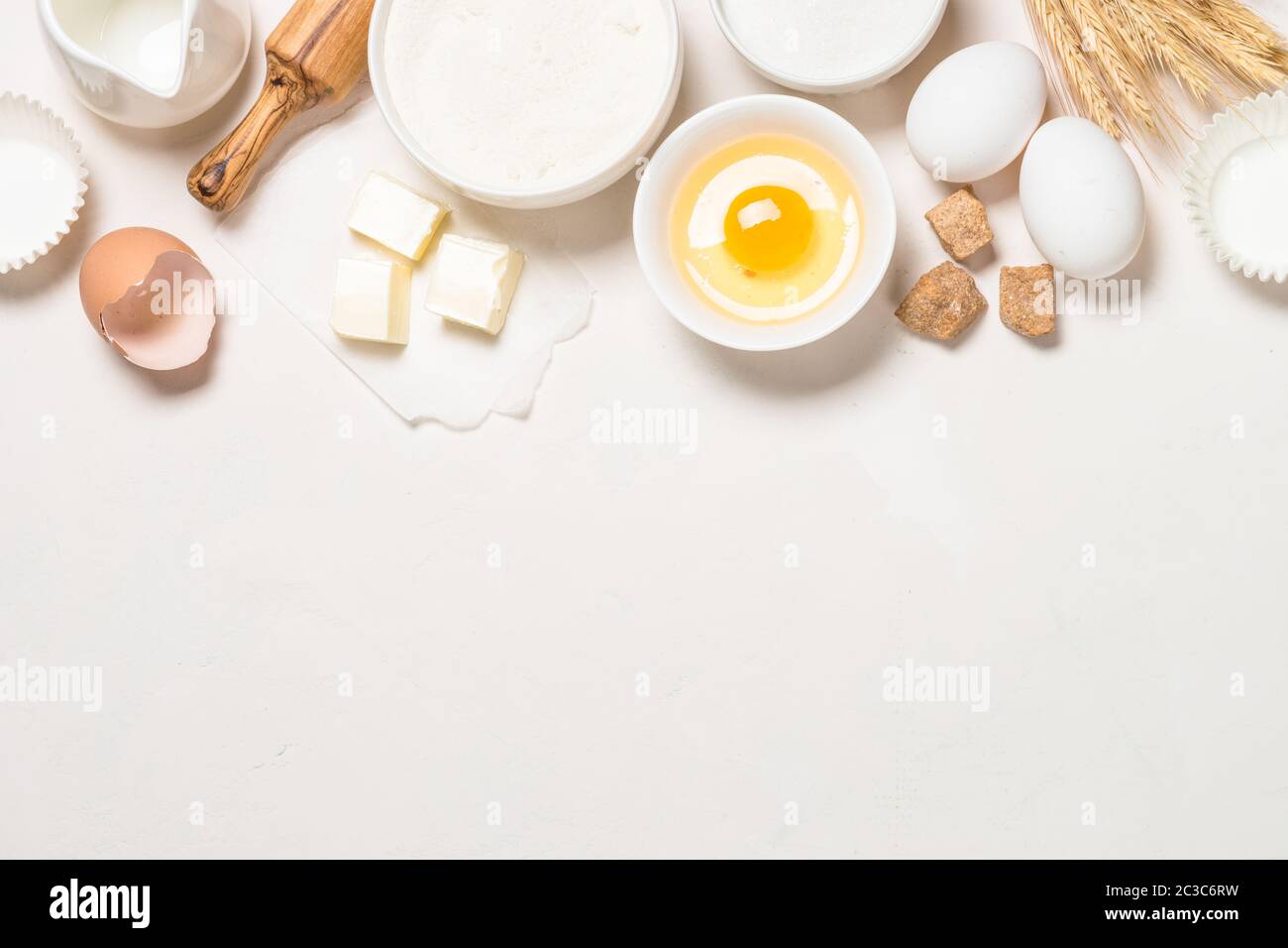 Baking ingredients at blue table top view Stock Photo - Alamy