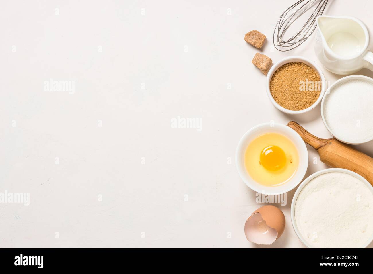 Baking ingredients at blue table top view Stock Photo - Alamy