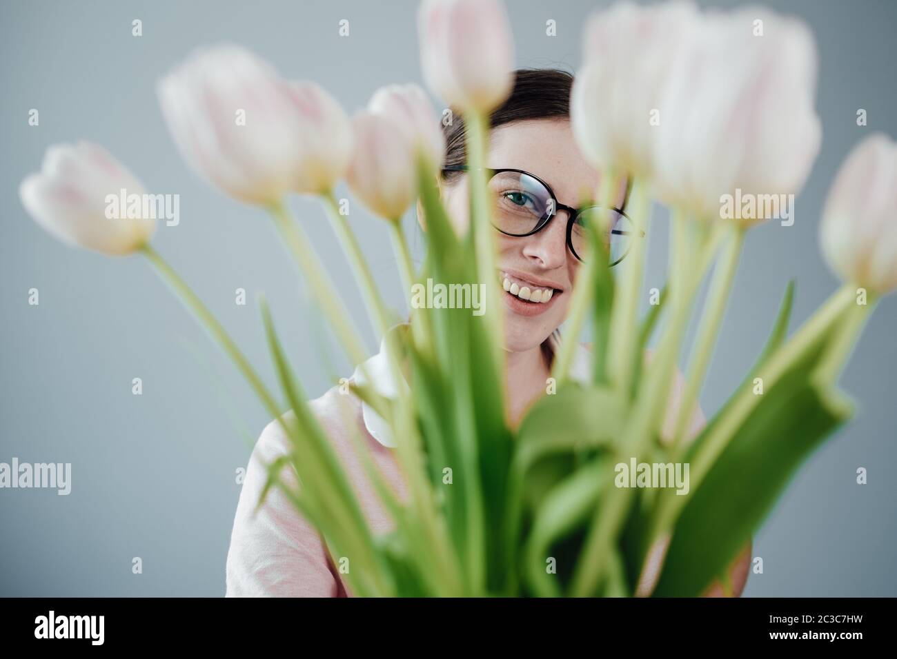 Studio Portrait of Young Adult Pretty Girl with Glasses Dressed in Pink ...