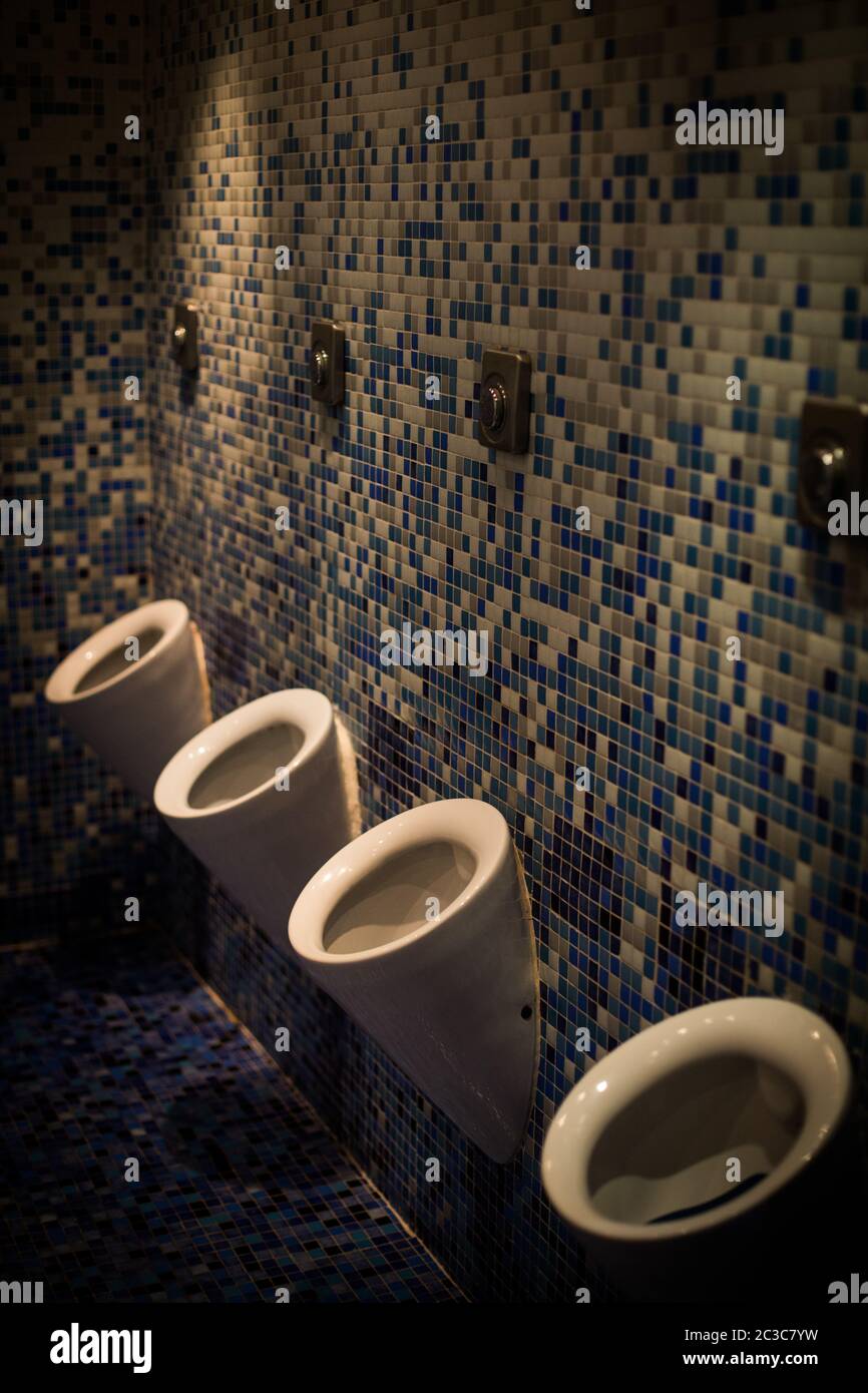 Color image of a men's public toilet Stock Photo - Alamy