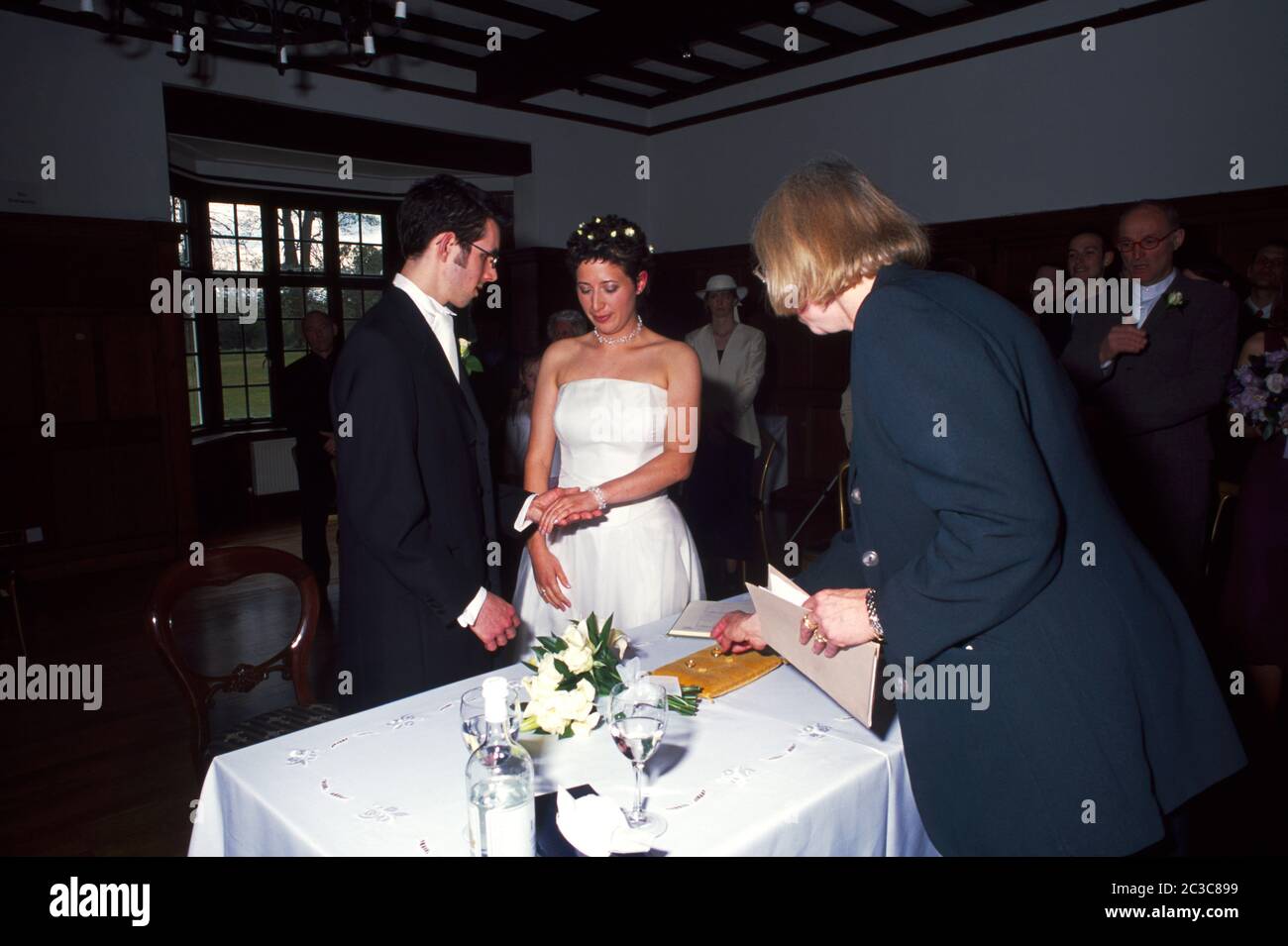 Bride and Groom taking Vows at Wedding with Registrar England Stock ...