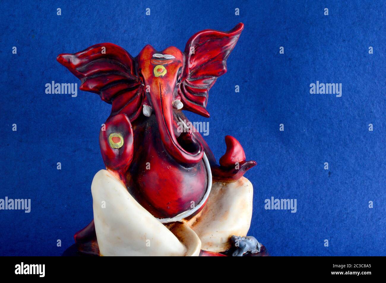 Hindu God Ganesha. Ganesha Idol on Blue Background Stock Photo - Alamy