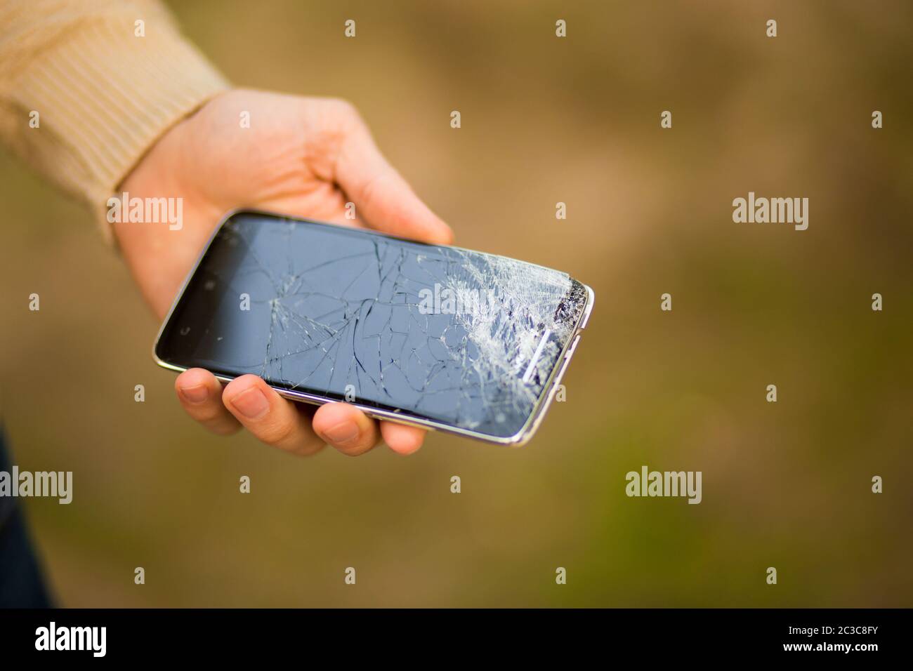 Broken display mobile in hand hi-res stock photography and images - Alamy