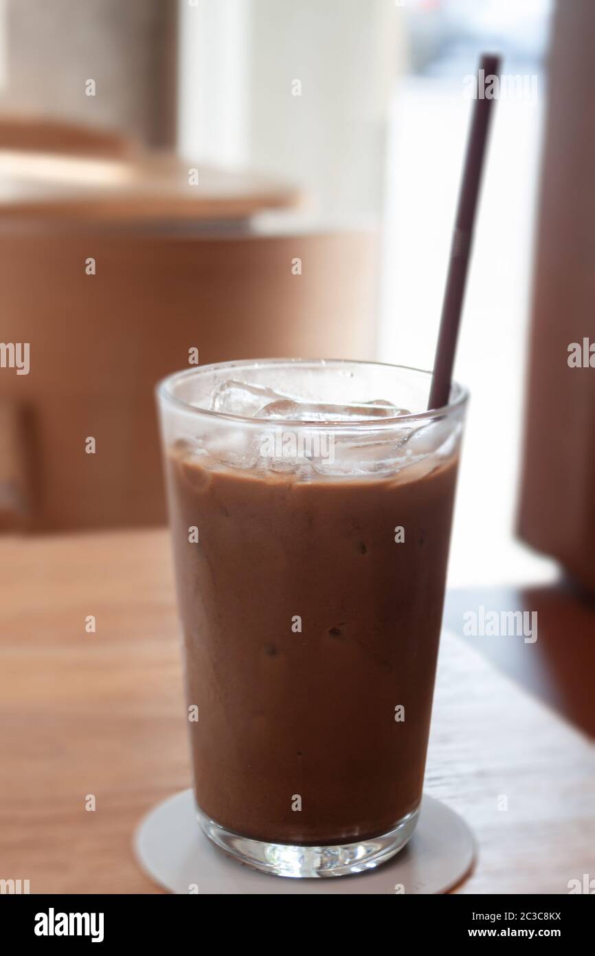 Iced coffee in coffee shop on wooden table, stock photo Stock Photo - Alamy