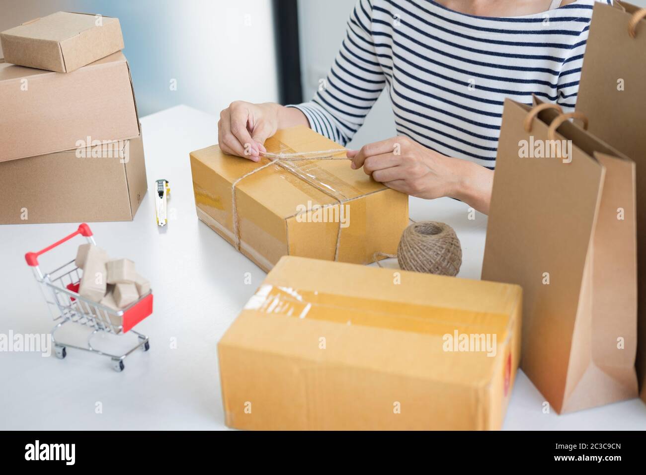 Business owner woman working online shopping prepare product packaging ...