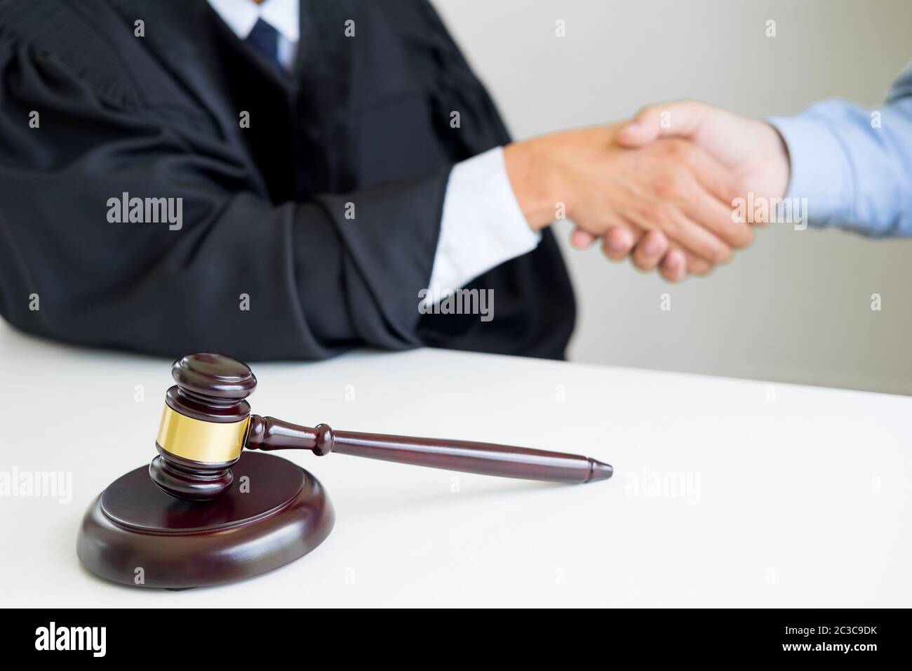 Judge lawyer shaking hands in hi-res stock photography and images - Alamy