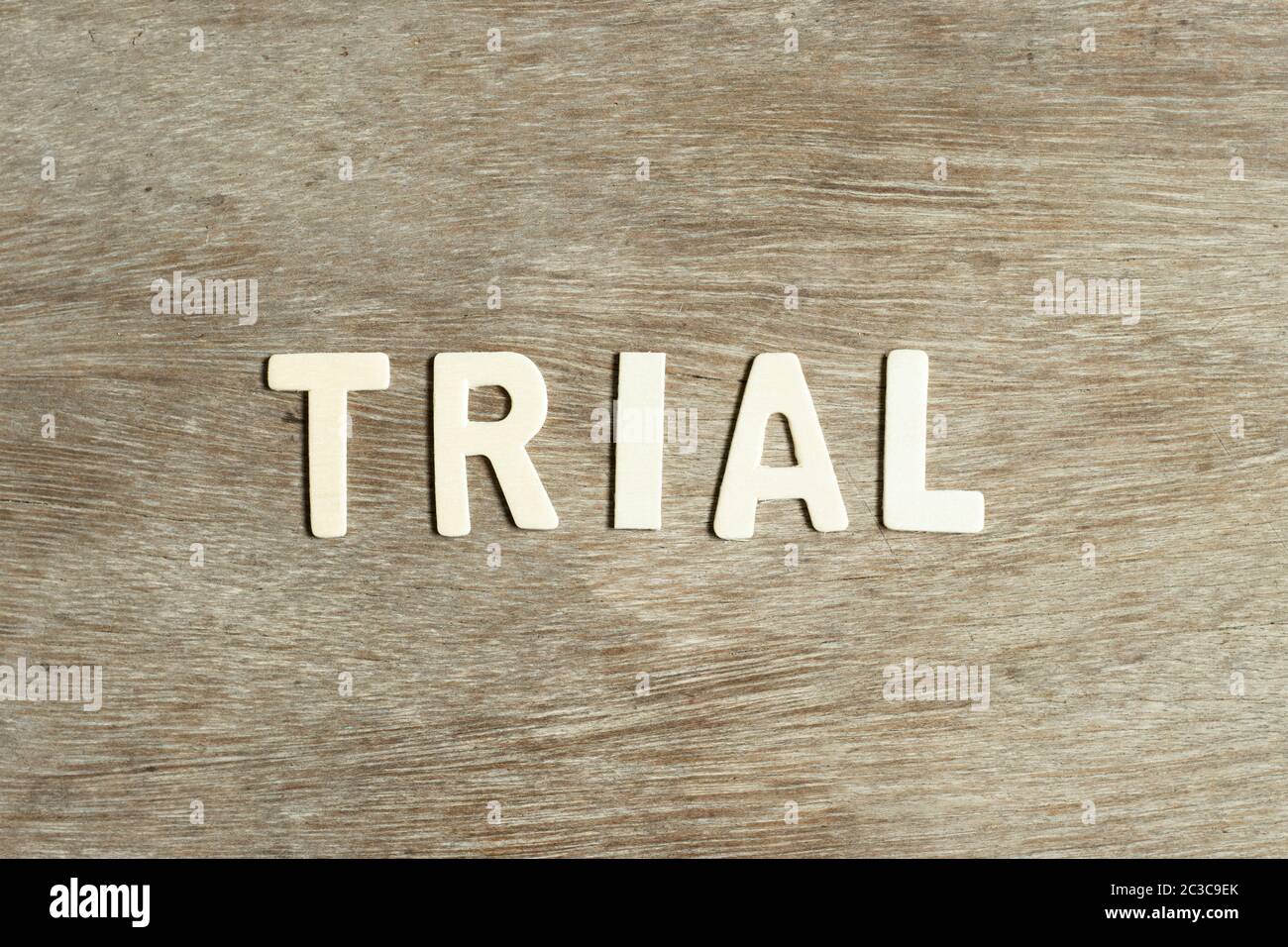 Alphabet letter in word trial on wood background Stock Photo - Alamy