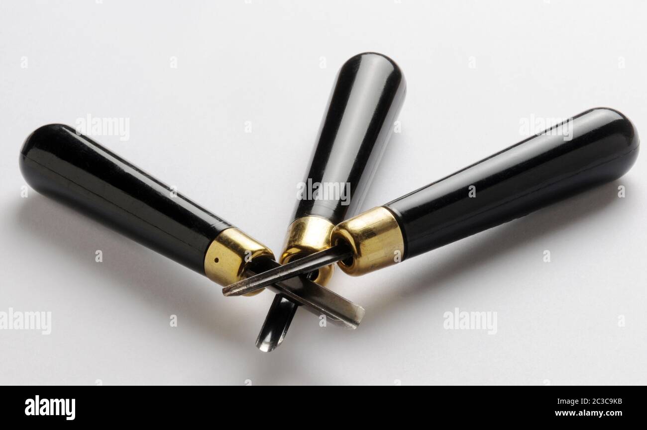 Gouges with black handle on a white background Stock Photo - Alamy