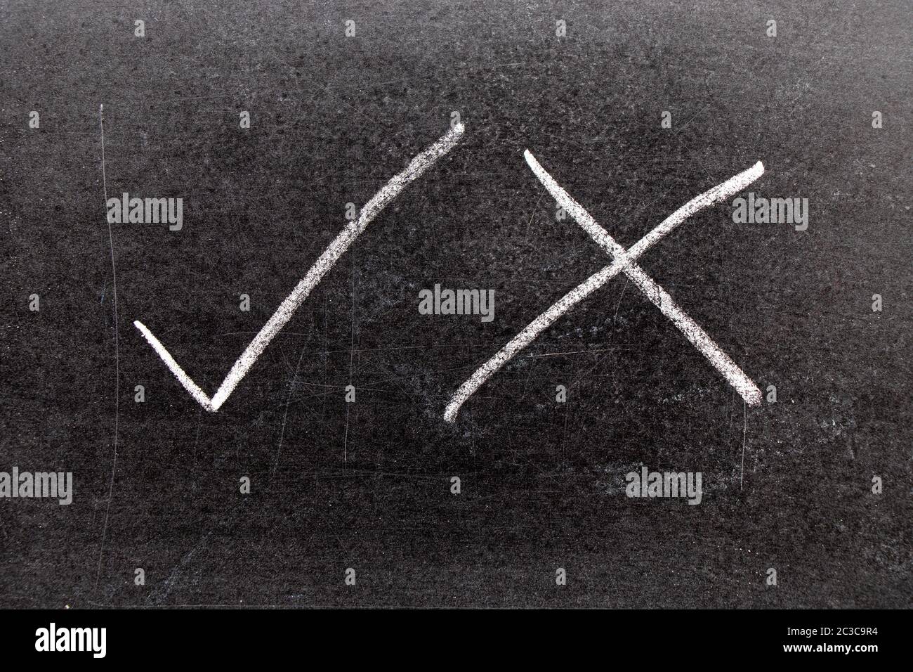 White color chalk hand drawing as check mark of right and wrong shape ...