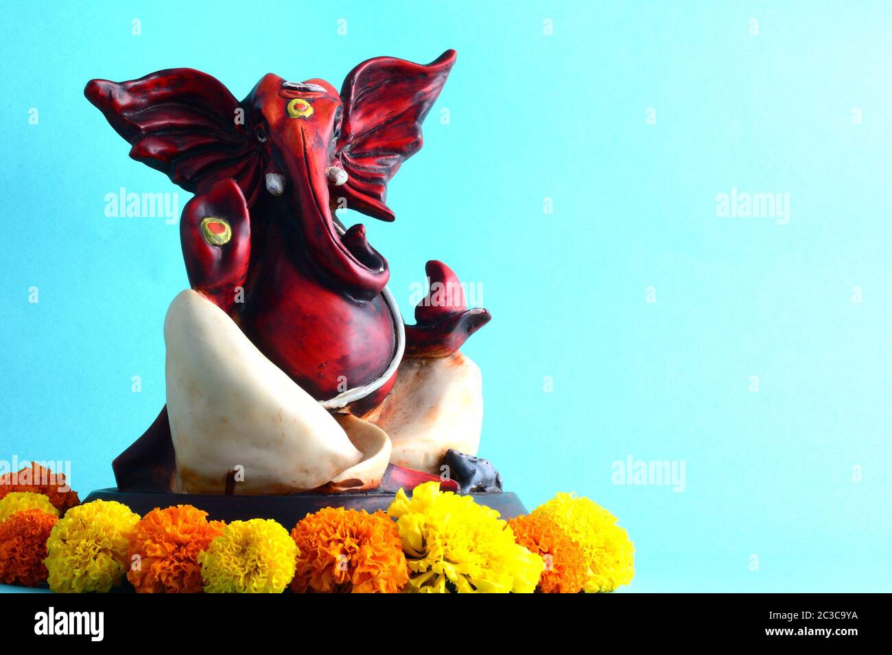 Hindu God Ganesha. Ganesha Idol on Blue Background Stock Photo - Alamy
