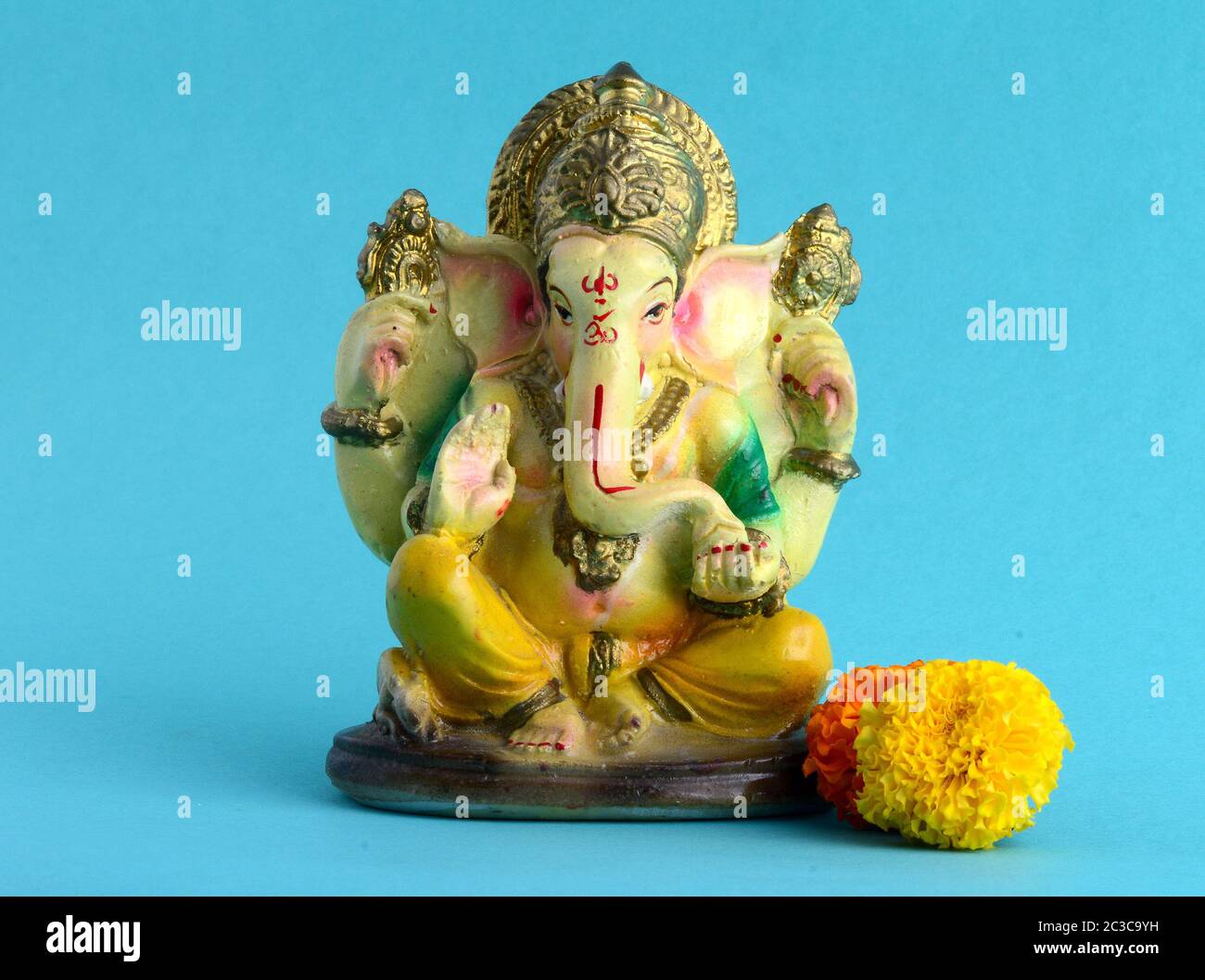 Hindu God Ganesha. Ganesha Idol on Blue Background Stock Photo - Alamy
