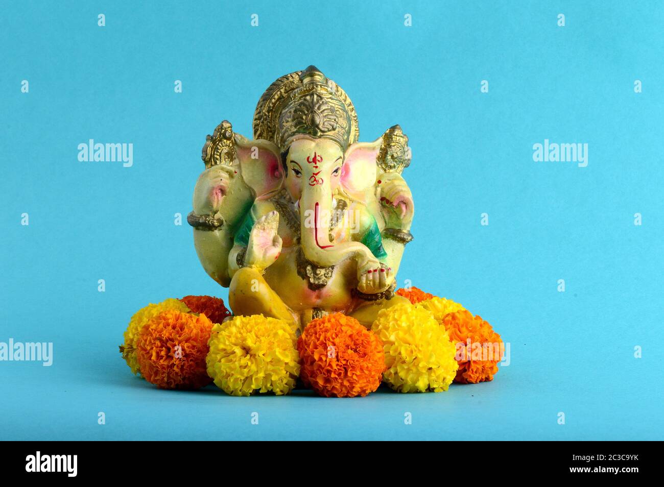 Hindu God Ganesha. Ganesha Idol on Blue Background Stock Photo - Alamy