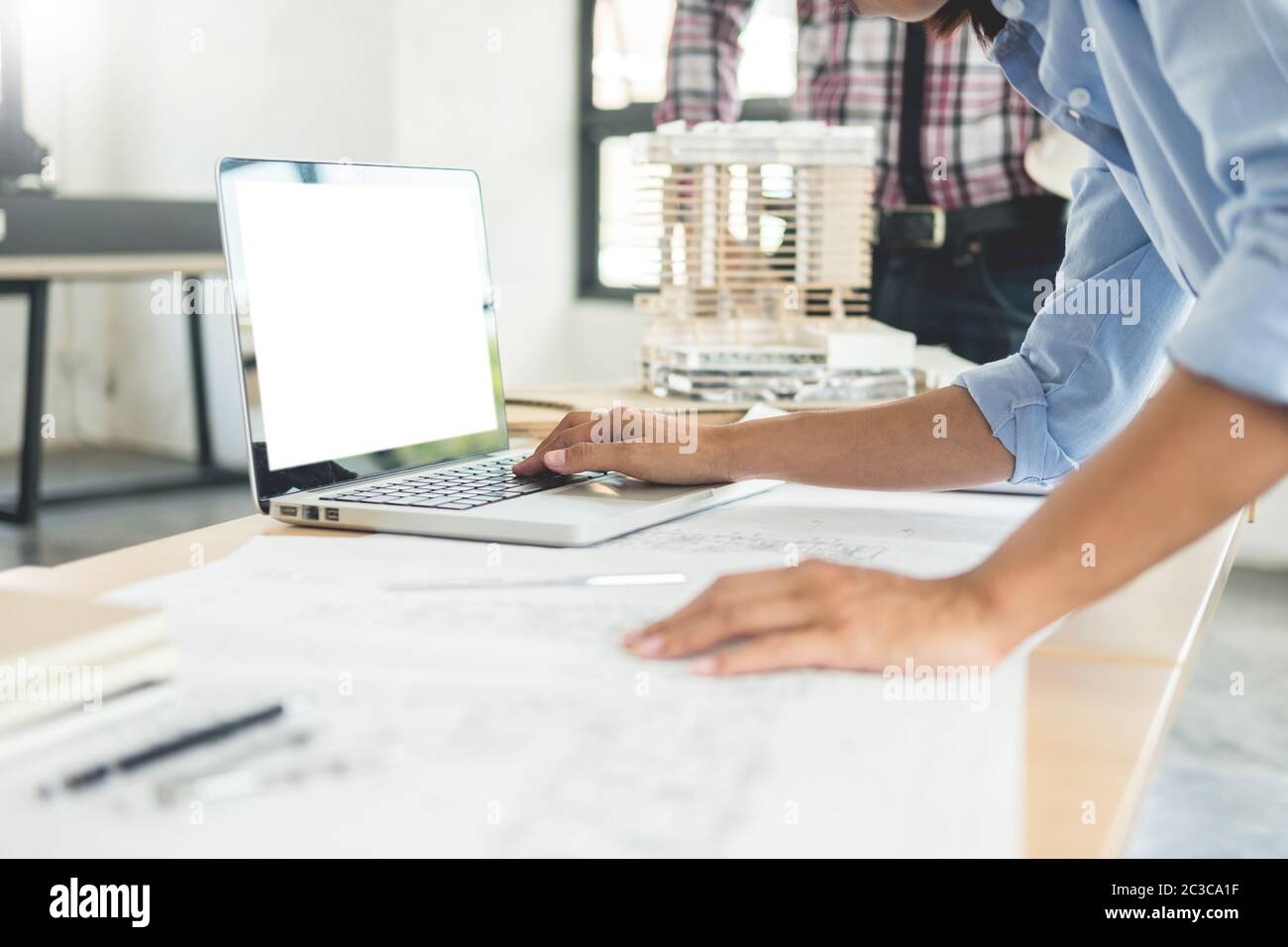 Close-up Of Person's engineer Hand Drawing Plan On Blue Print with ...