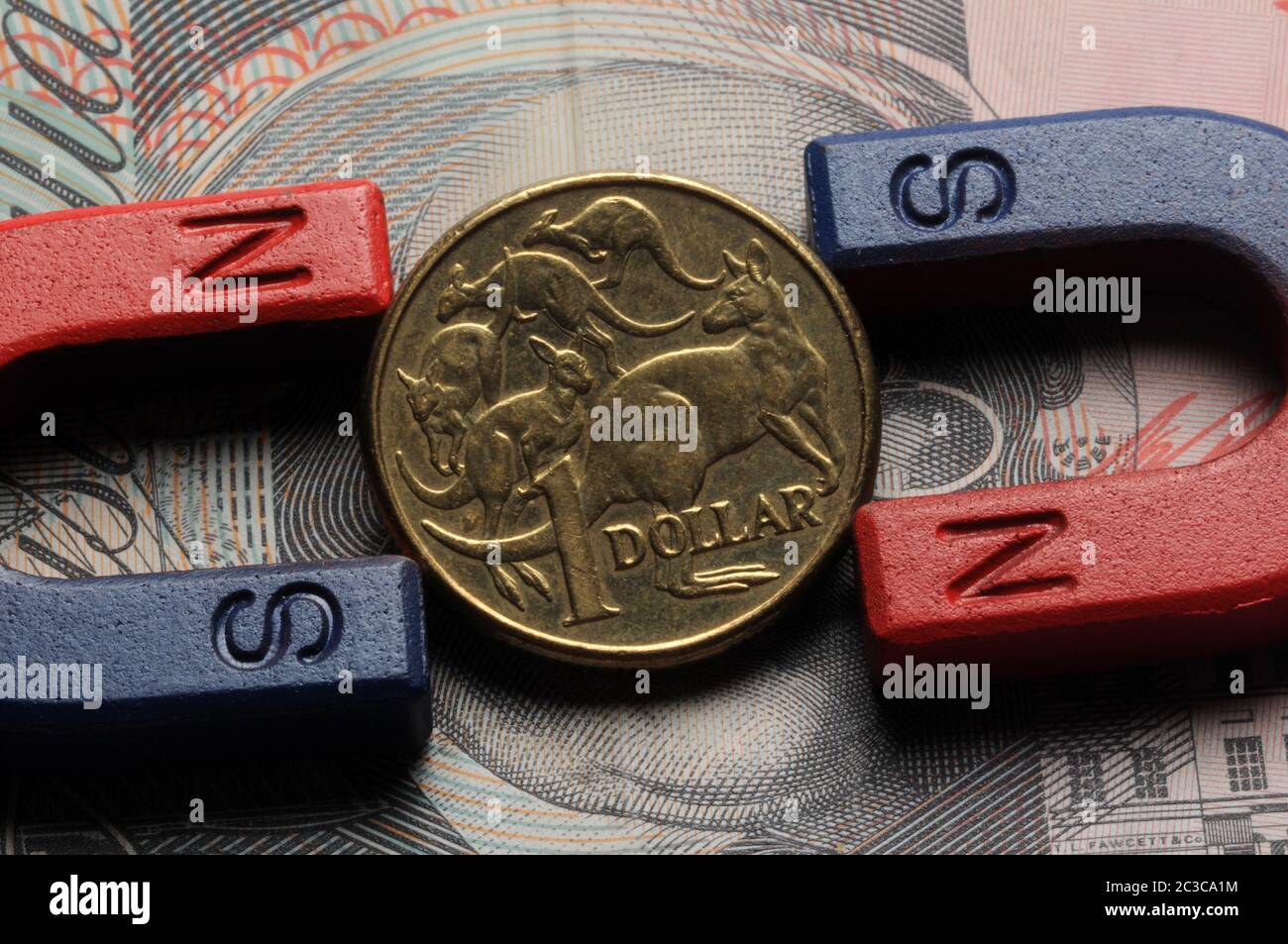 Australian coin with magnets on banknote Stock Photo - Alamy