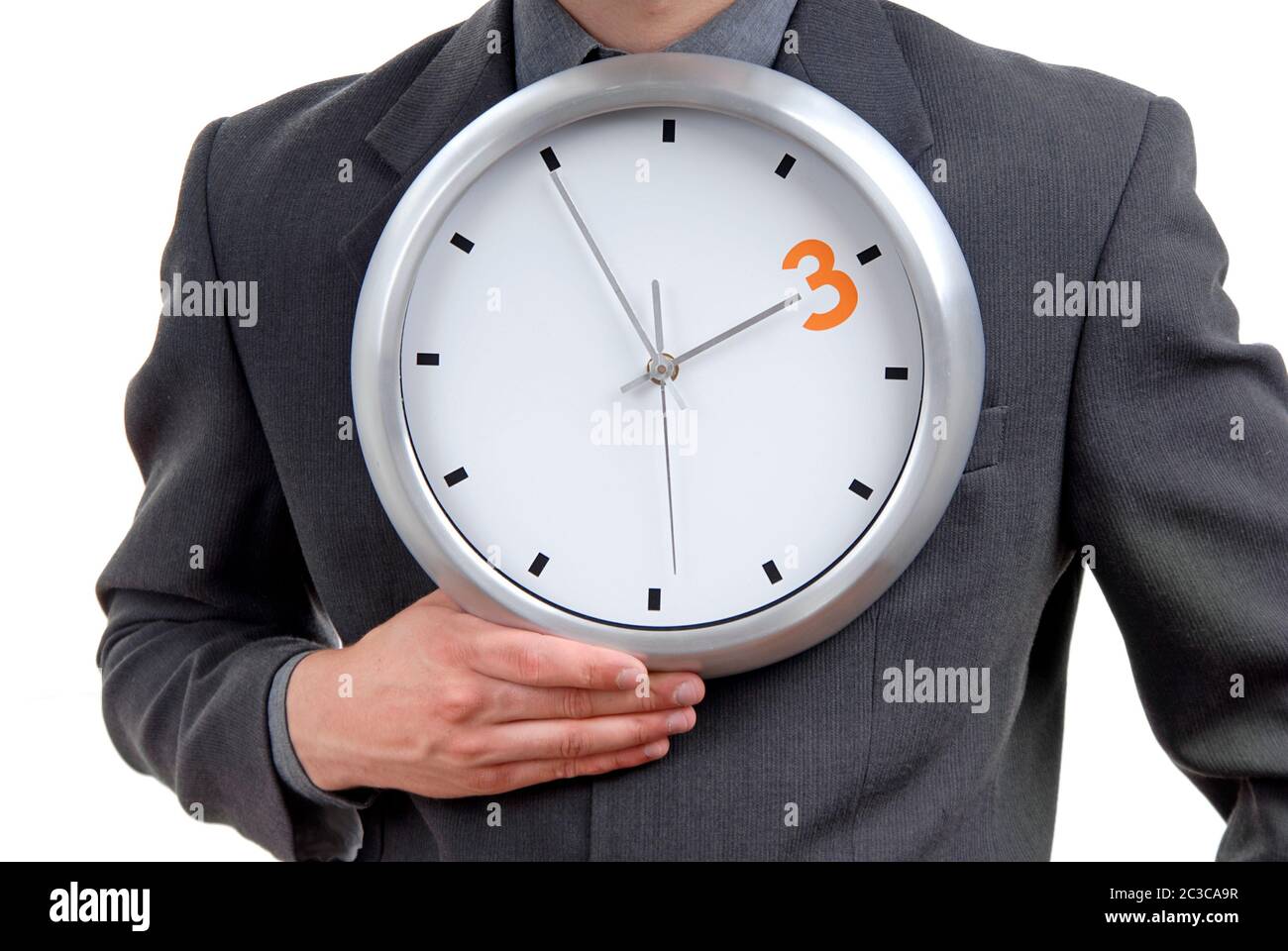 business man wearing suit holding clock detail Stock Photo - Alamy