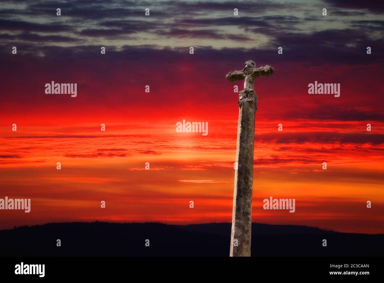 stone cross with the sunset as background Stock Photo - Alamy
