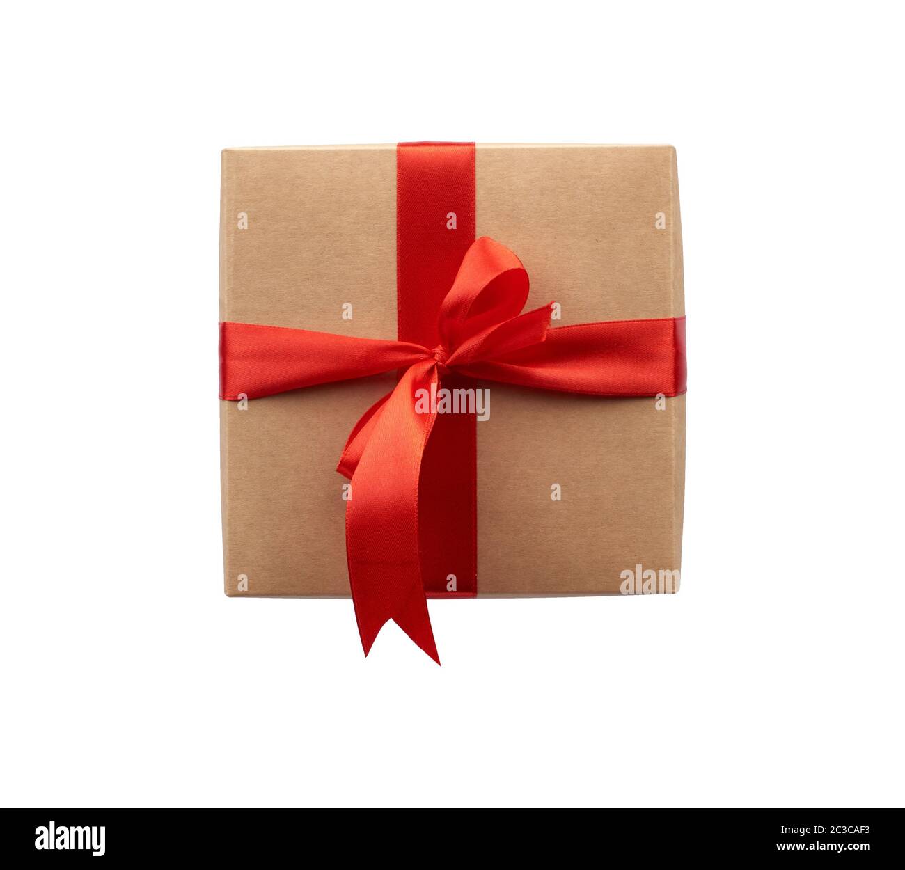 square box wrapped in brown kraft paper and tied with a red ribbon ...