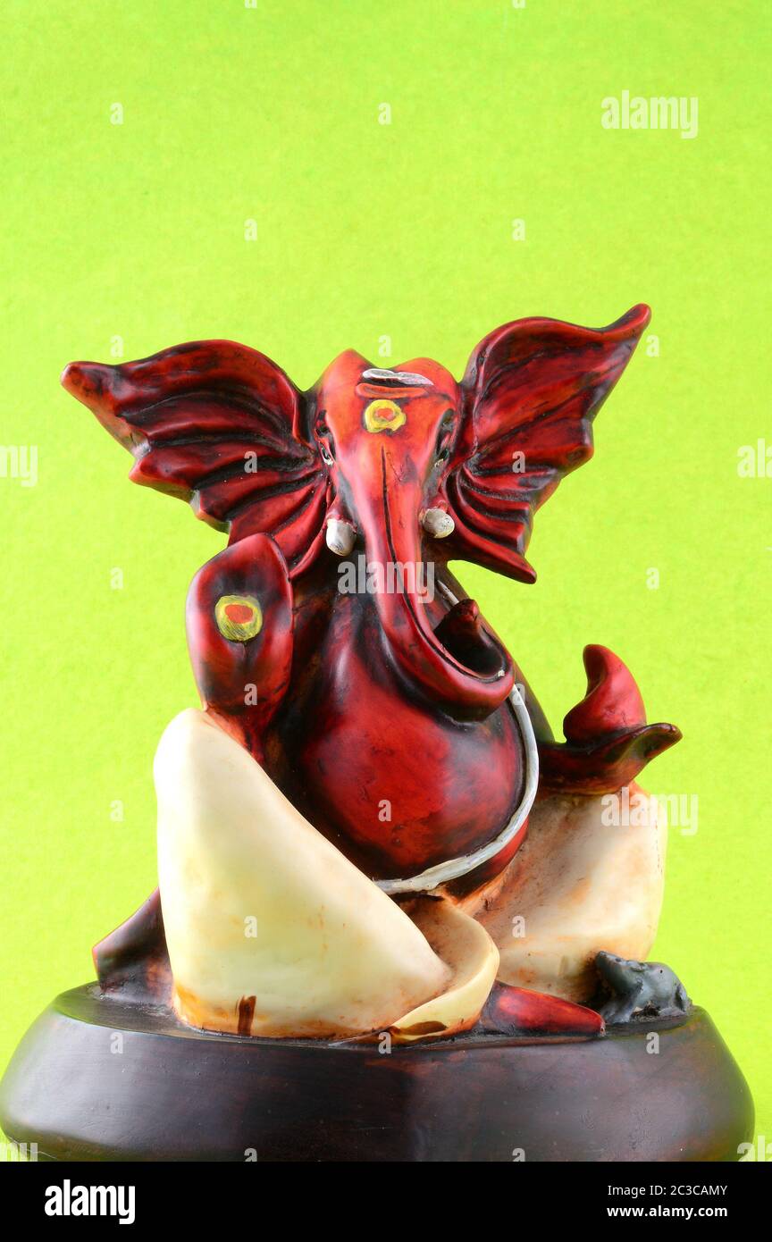 Hindu God Ganesha. Ganesha Idol on Green Background Stock Photo - Alamy
