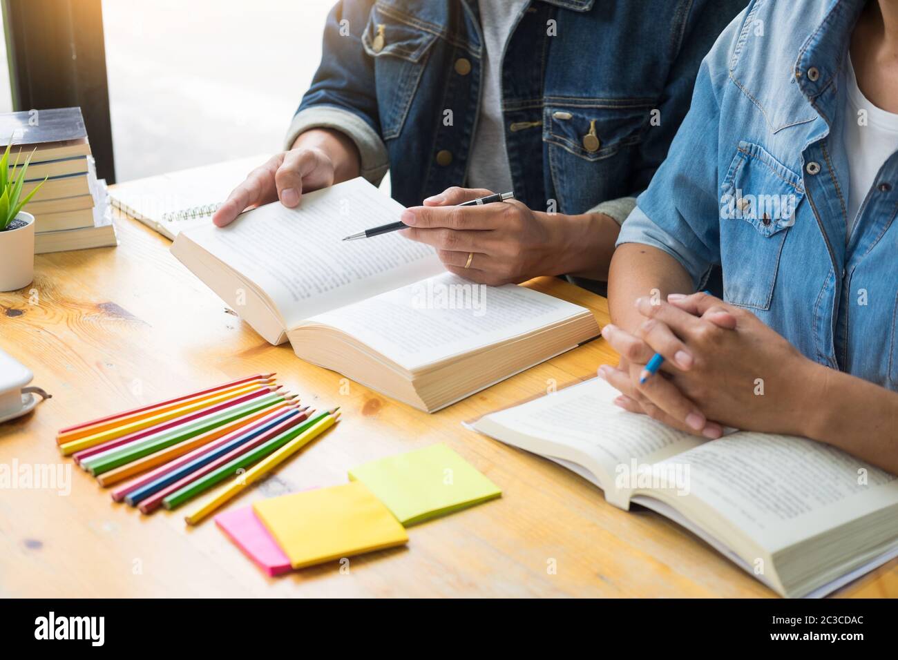 Students studying and brainstorming campus at the university education ...