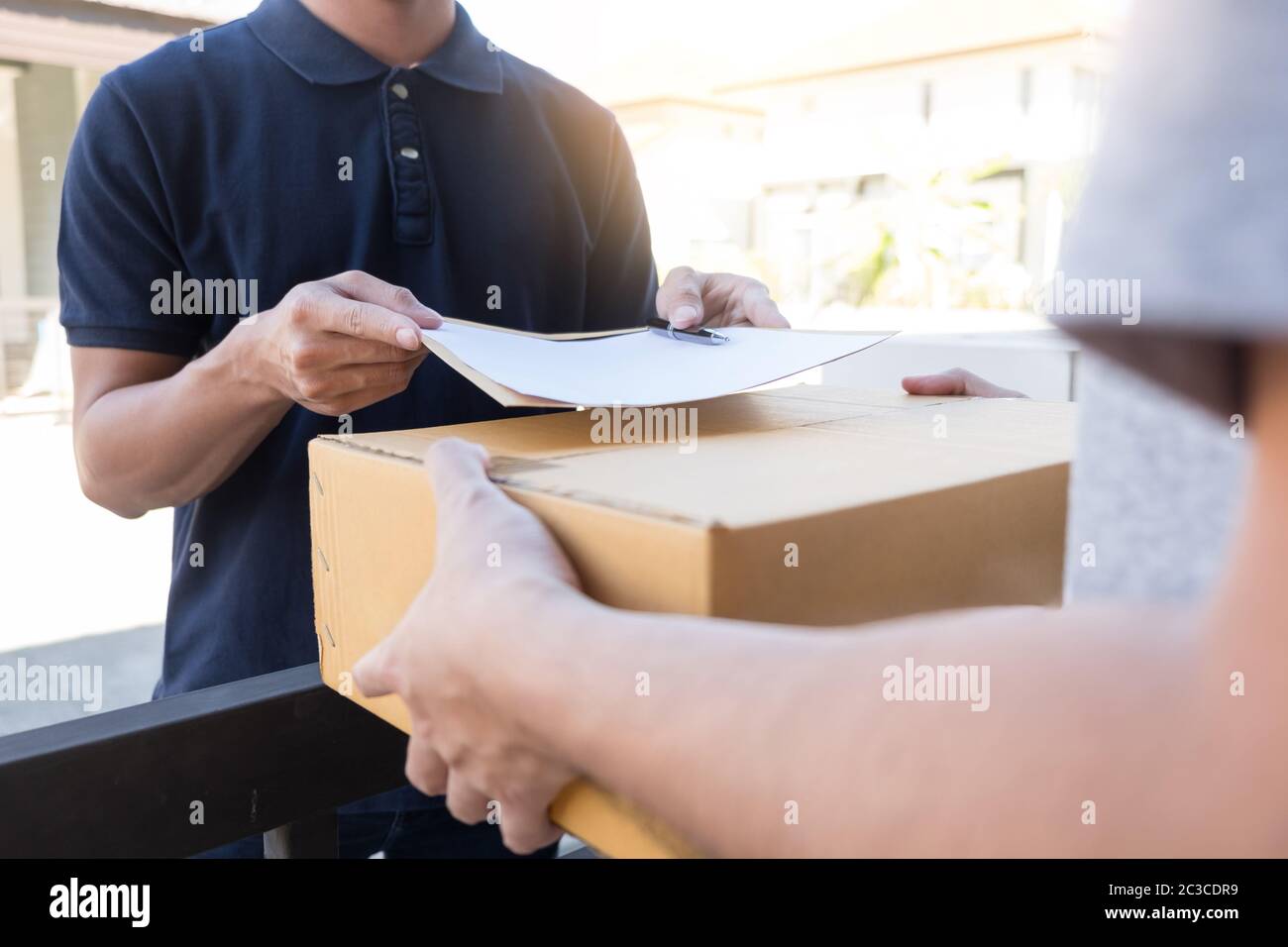 delivery service concept, customer hand receiving a cardboard boxes ...