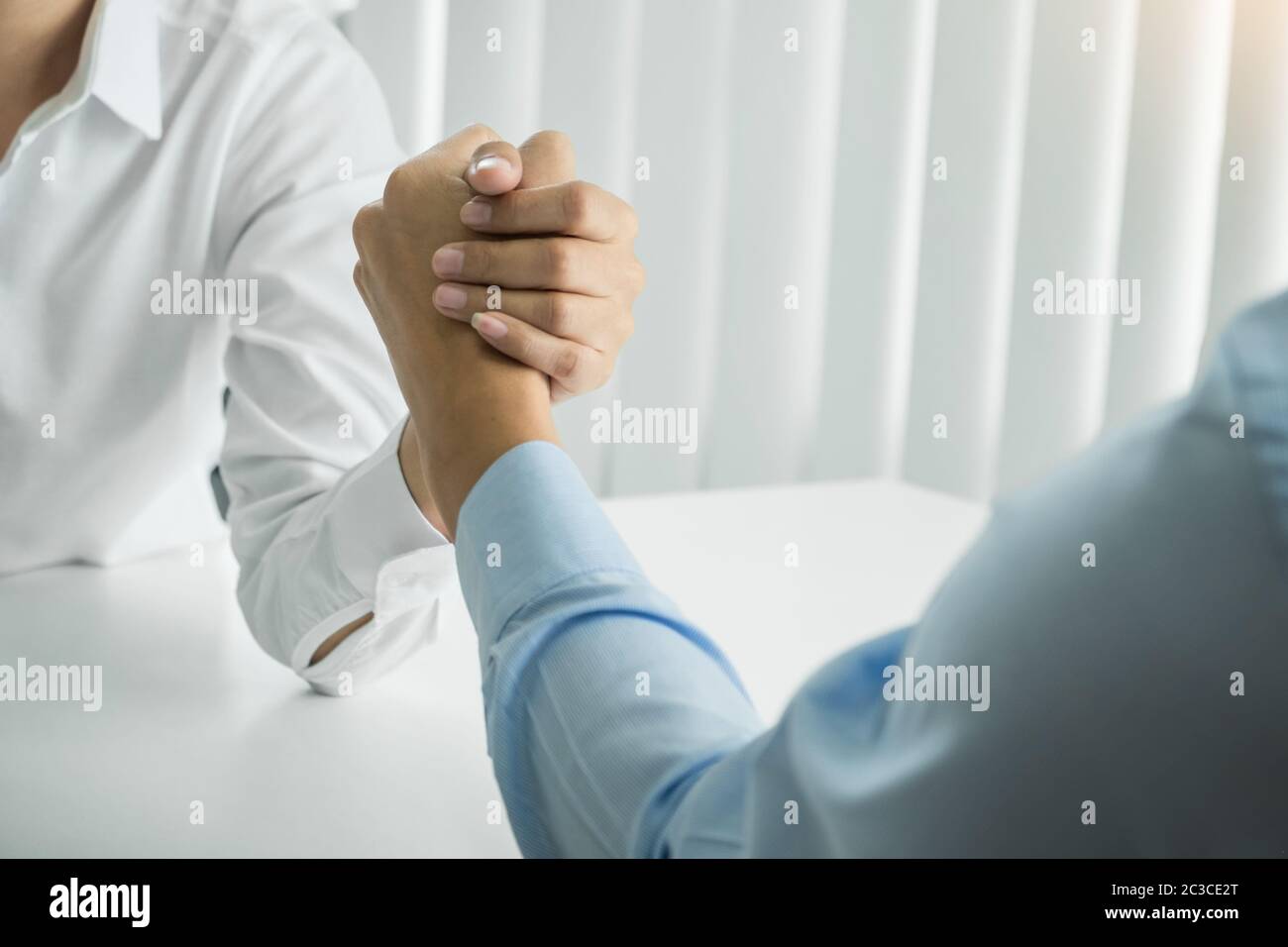 Multiracial white hands clasped hi-res stock photography and images - Alamy