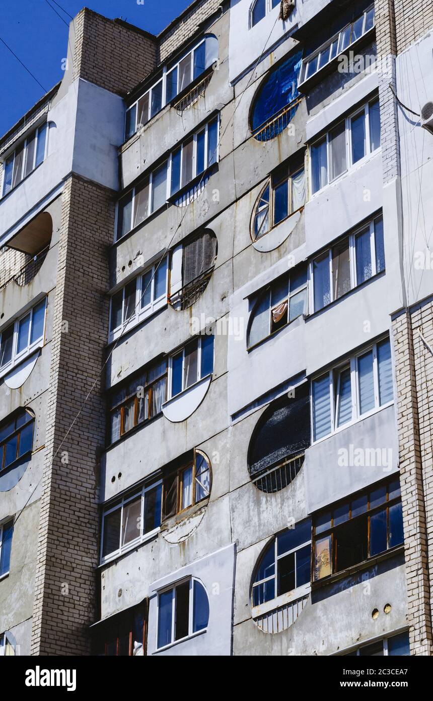 Facade of apartment buildings with curly balconies. Brick multi-storey ...