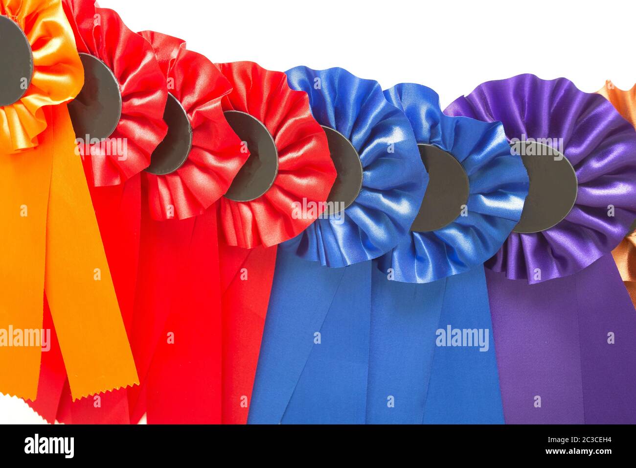 A lots of ribbons rosettes medals overlapping in a row background ...