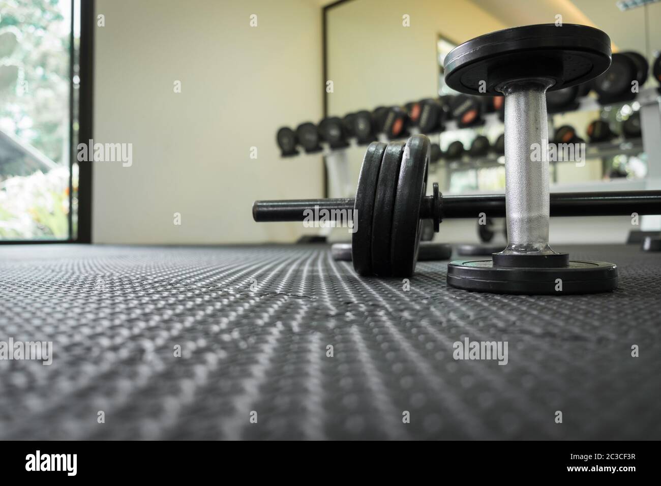 exercise weights - iron dumbbell with extra plates Stock Photo - Alamy