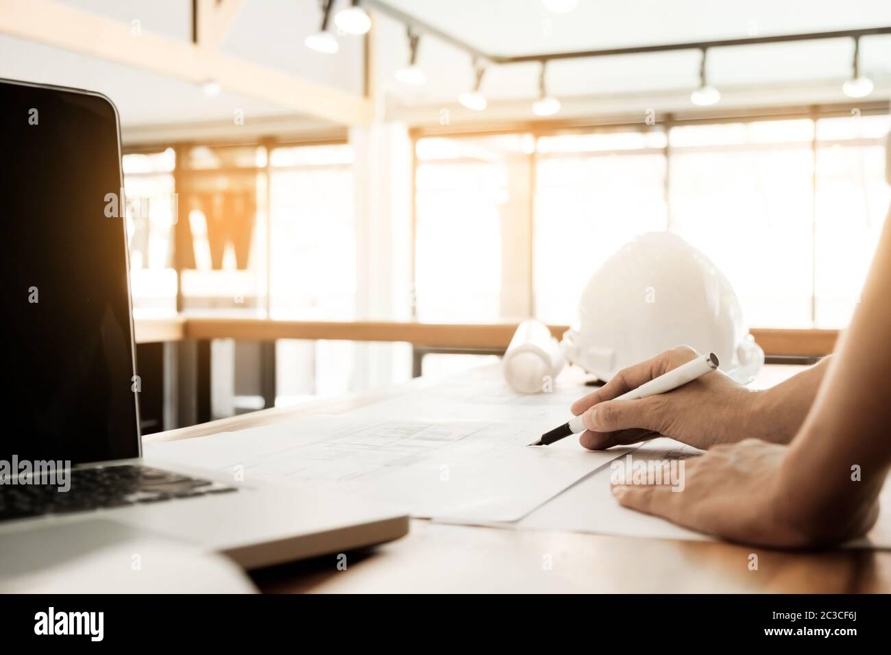 Engineer of architect starting draw a house blueprint on the desk in ...