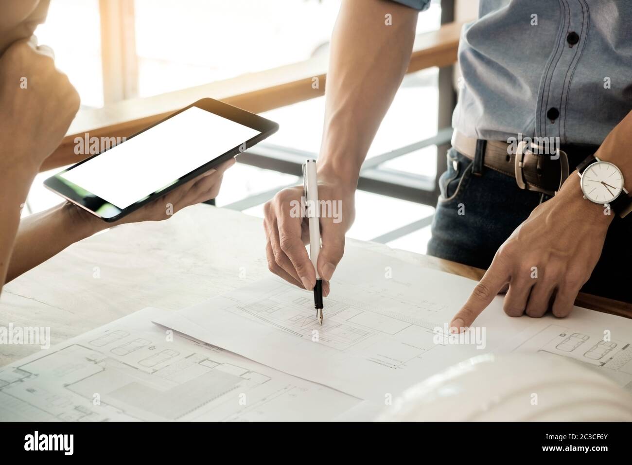 Two Architects engineer discussing data working and tablet, laptop with ...