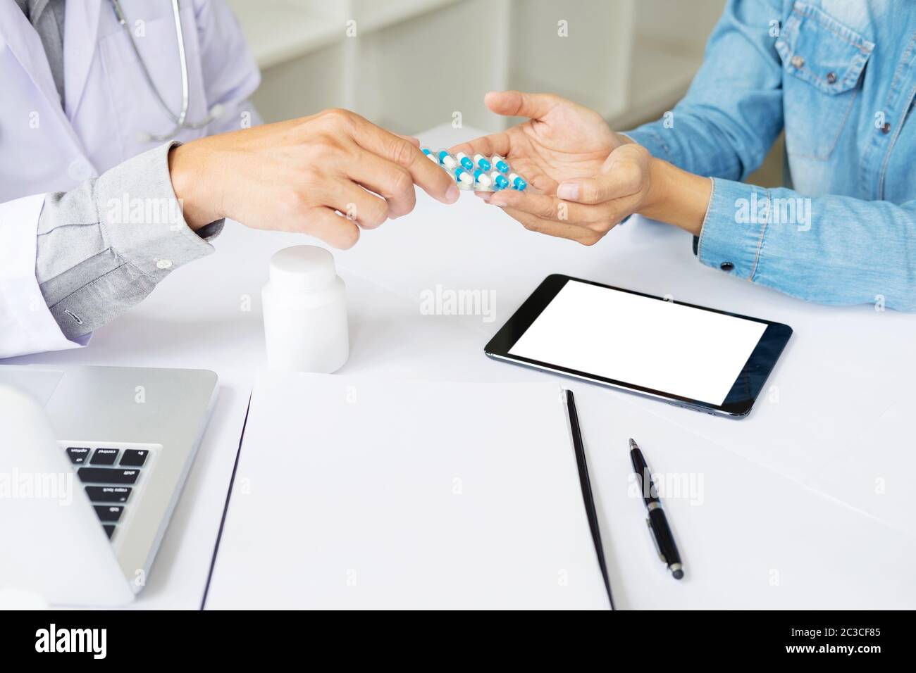 Female doctor hand holding tablet to patient in hospital room Stock ...