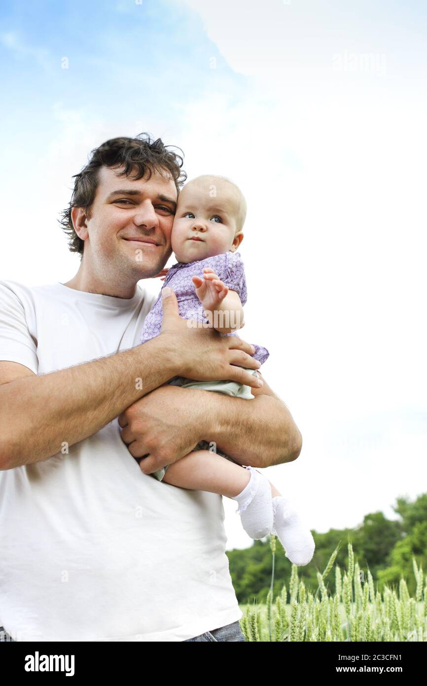 Happy father with baby in rural field Stock Photo - Alamy