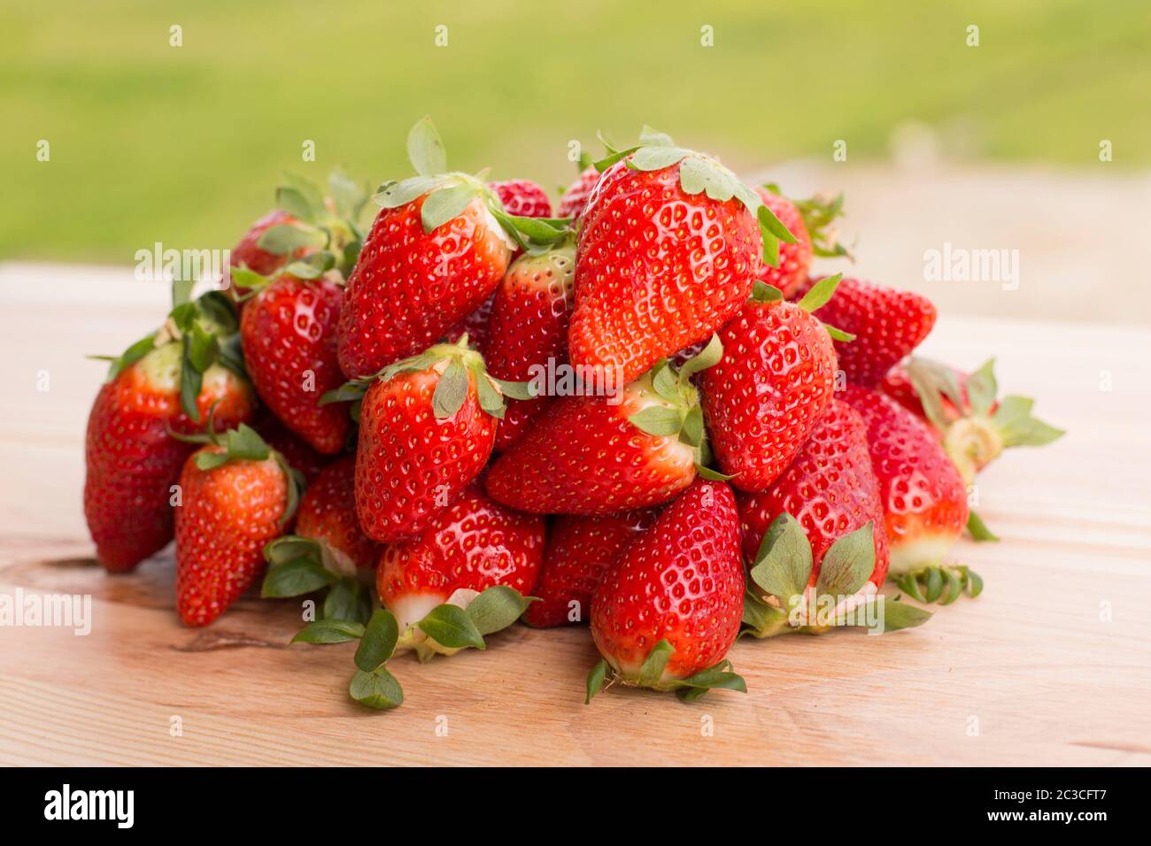strawberries on garden's table, outdoor picture Stock Photo - Alamy