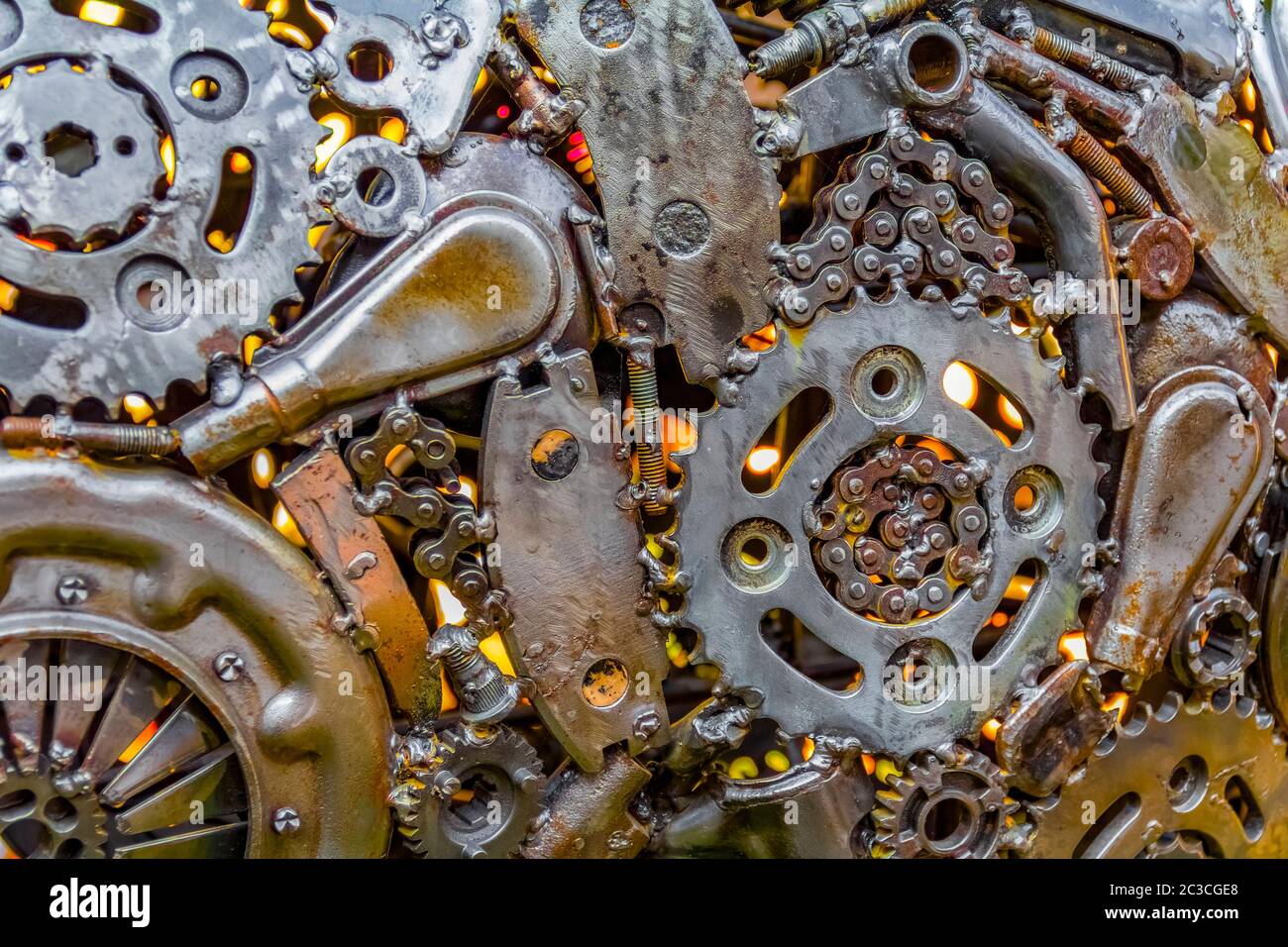 full frame warm illuminated metallic mechanical background with gear ...