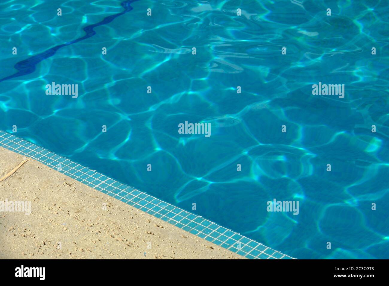 swimming pool blue water in a summer day Stock Photo - Alamy