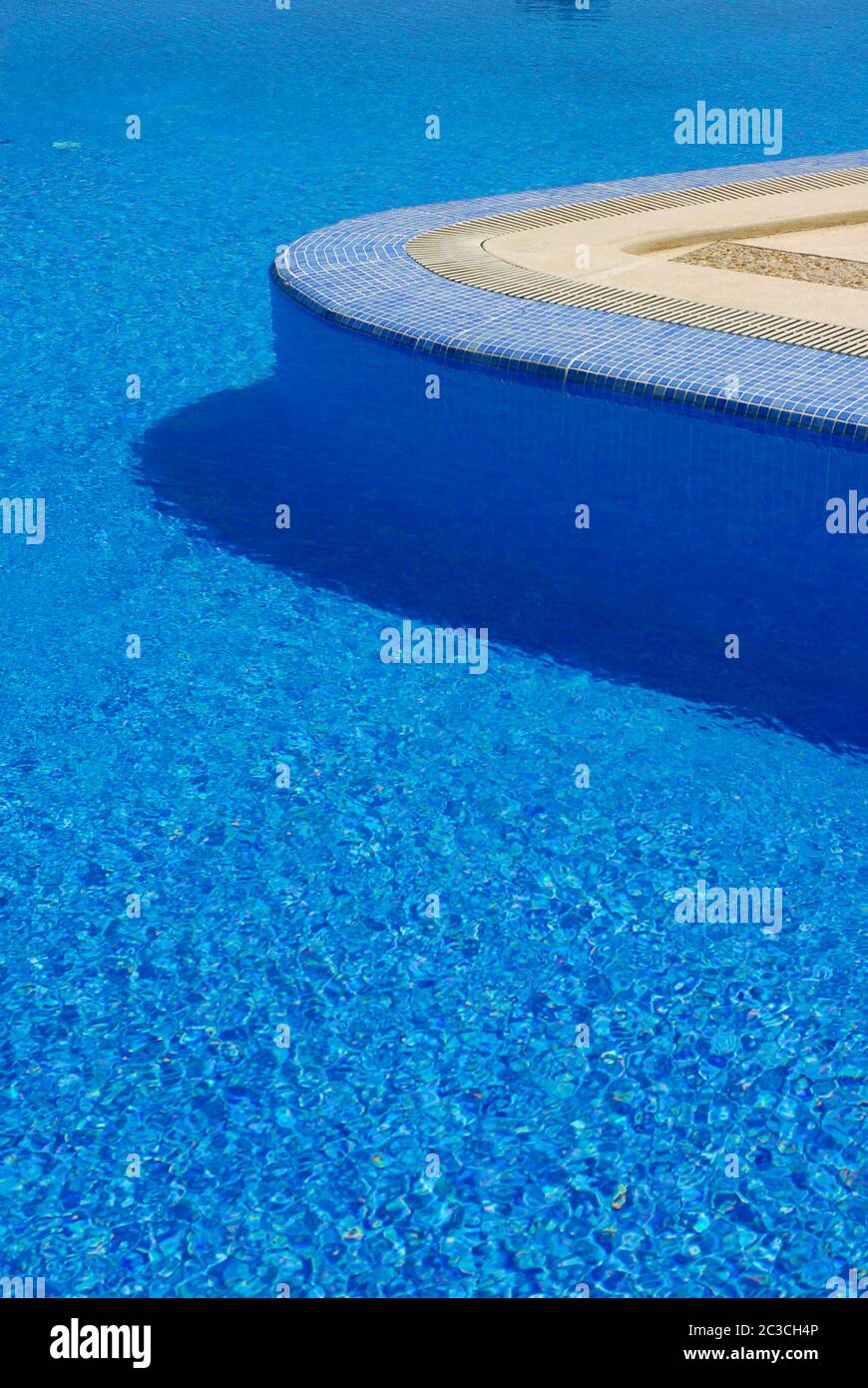 swimming pool blue water in a summer day Stock Photo - Alamy