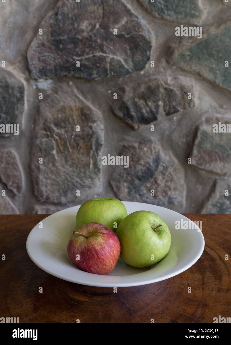 Three green apples on plate hi-res stock photography and images - Alamy