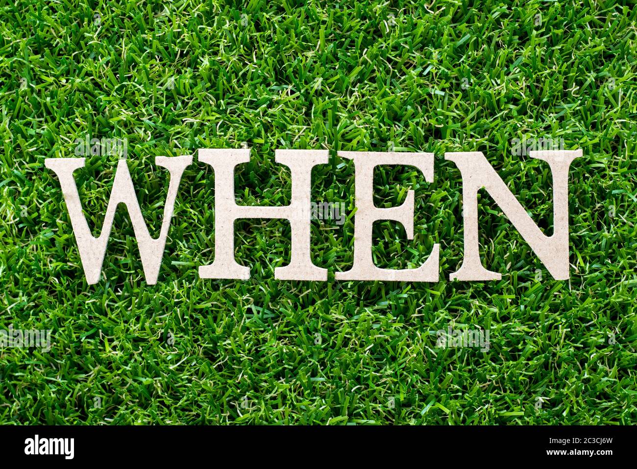 Wood letter in word when on artificial green grass background Stock ...