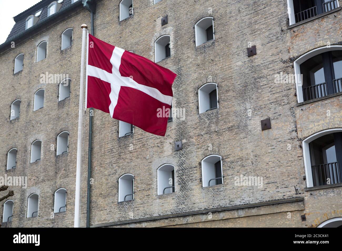 Danish flag waving in the wind outdoors Stock Photo - Alamy