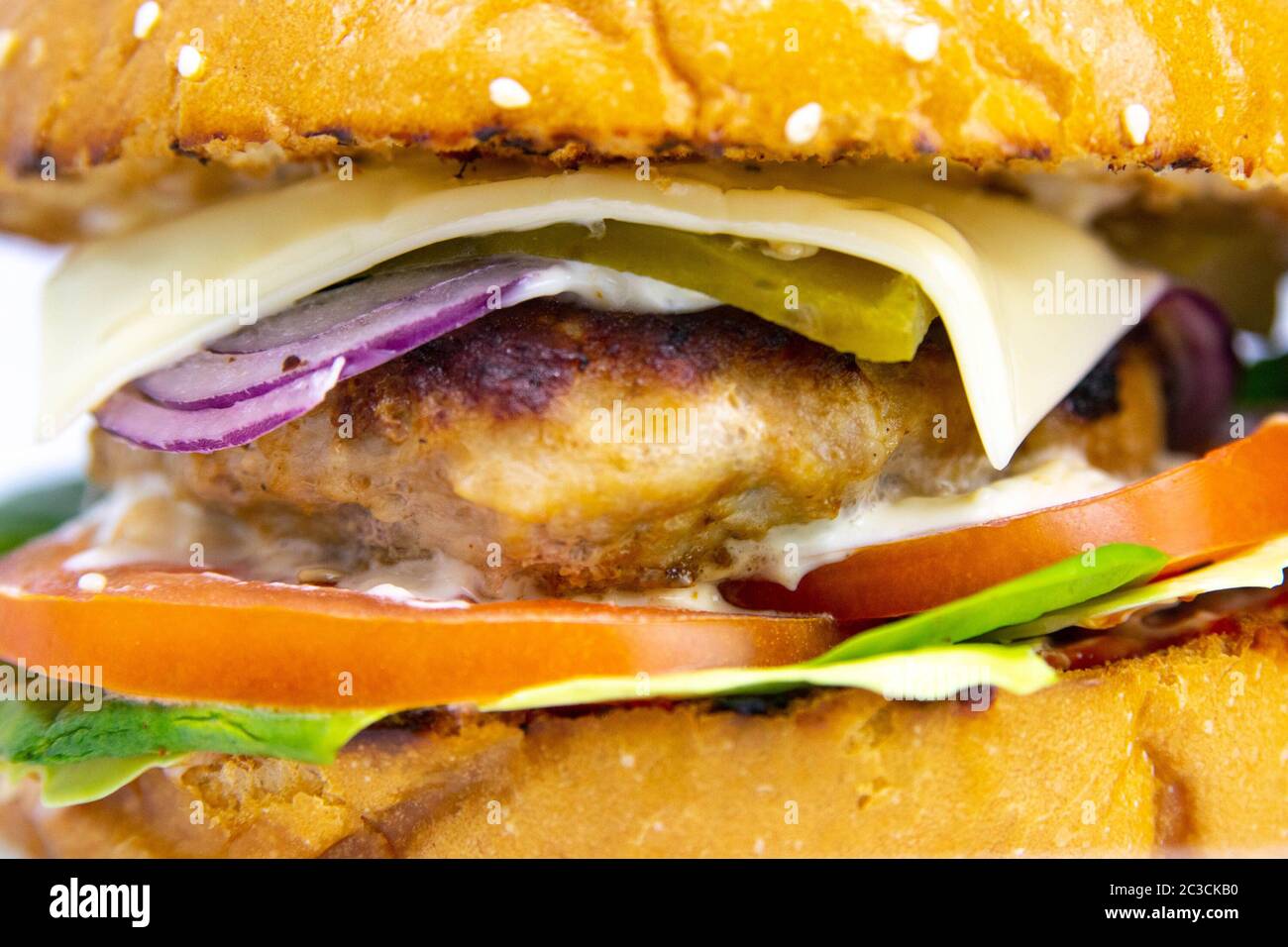 Burger toppings visible near, macrophotography front views Stock Photo ...