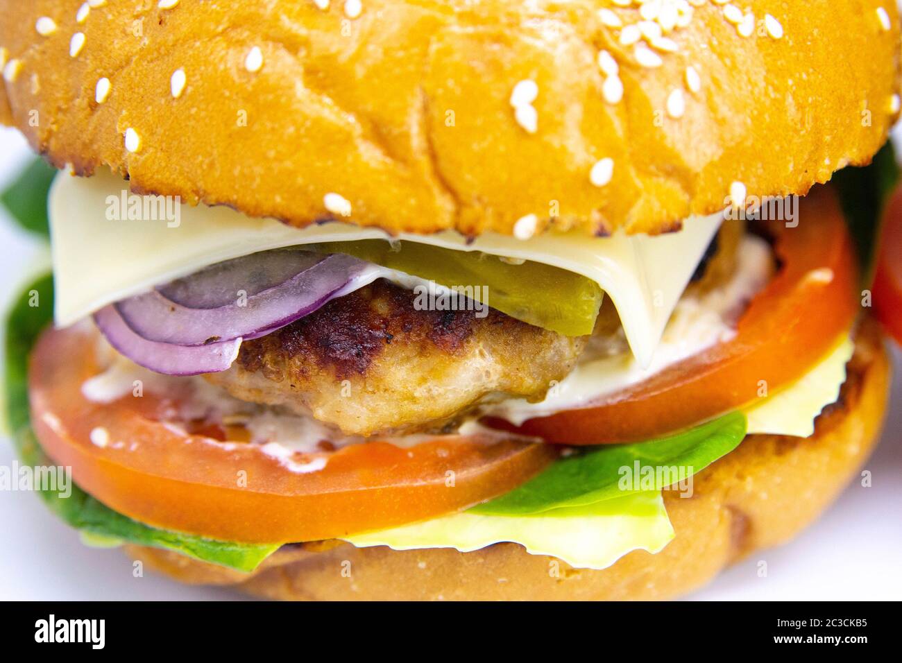 Burger toppings visible near, macrophotography front views Stock Photo ...