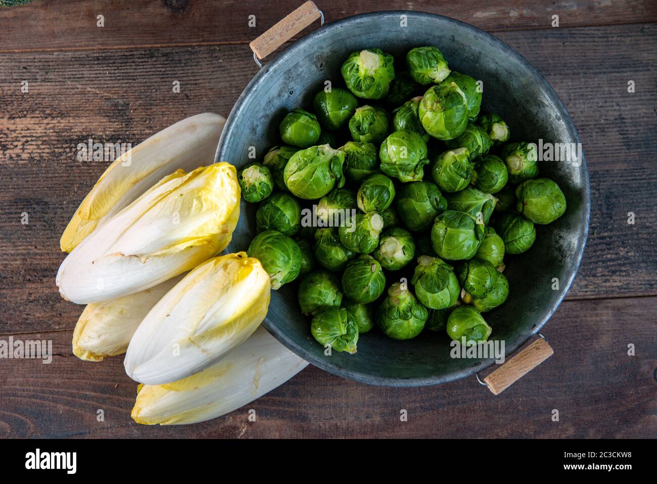 sprouts and endives on a wooden background, Belgian vegetables Stock ...