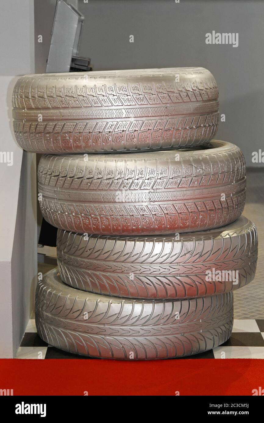 Stack of four car tyres for summer season Stock Photo - Alamy